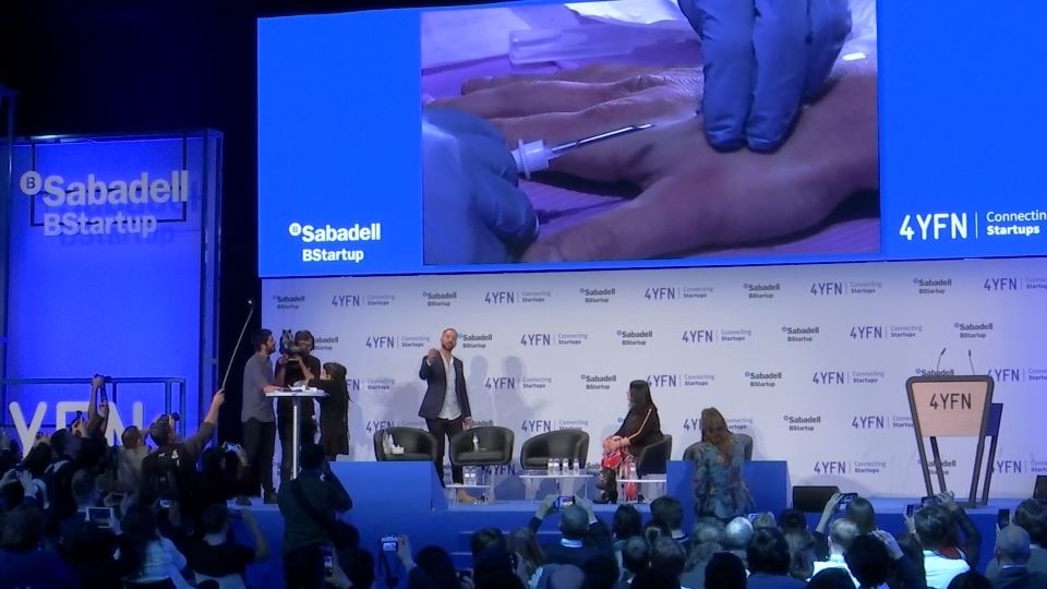 Man receives under-skin chip implant live at mobile show | Reuters