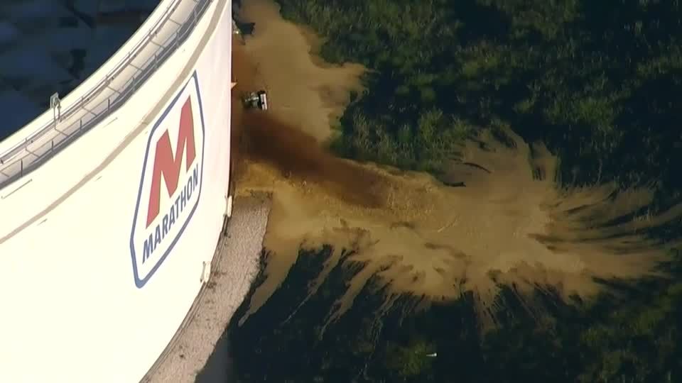 Crews containing crude oil gushing out of tank at Marathon refinery ...