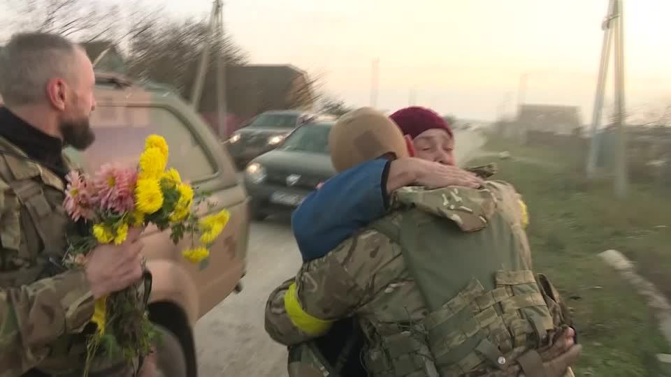 Villagers greet Ukrainian soldiers with flowers | Reuters