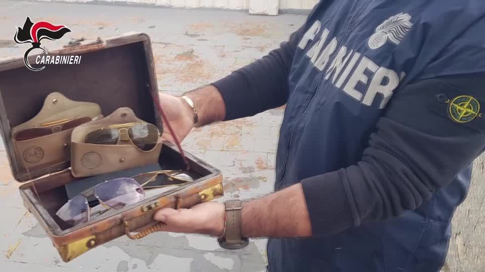 Sunglasses, champagne in mafia boss' family home | Reuters