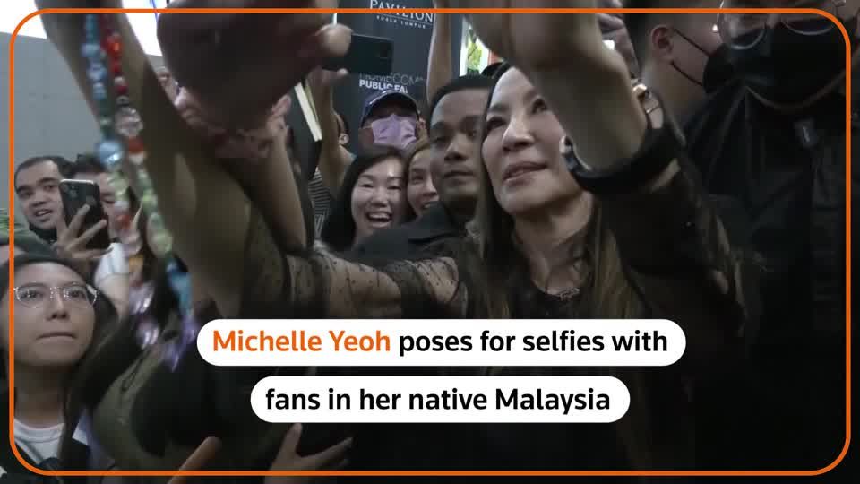 Michelle Yeoh greets fans in her native Malaysia