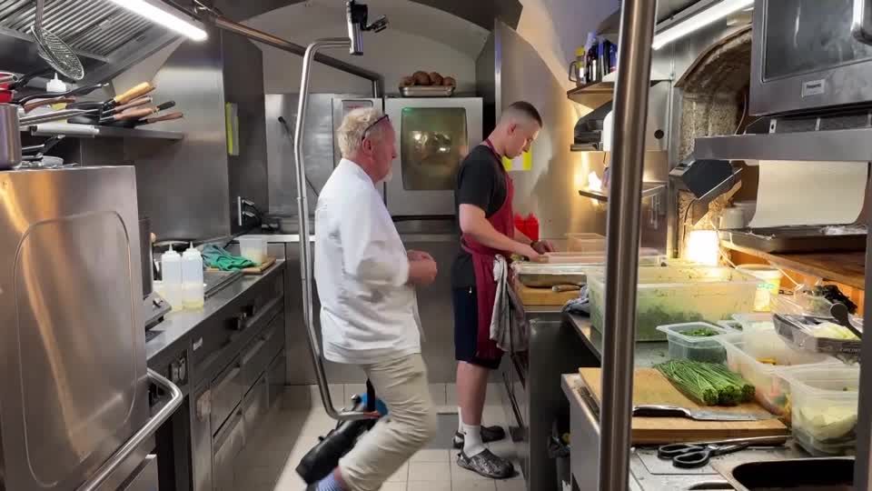 Austrian chef defies doctors with device that keeps him cooking | Reuters