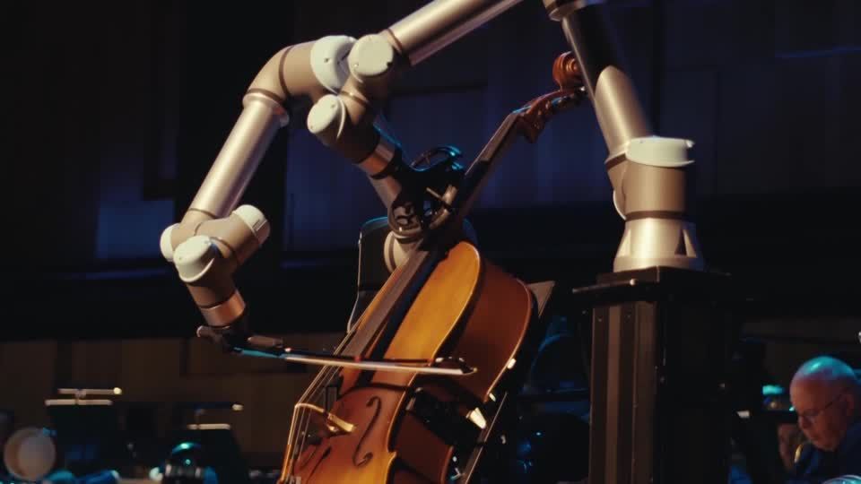 Cello-playing robot performs with symphony orchestra in Sweden | Reuters