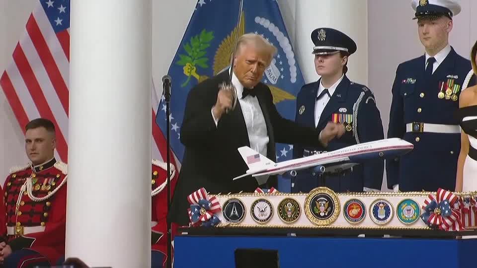 Trump dances with a sword at the Commander in Chief Ball | Reuters