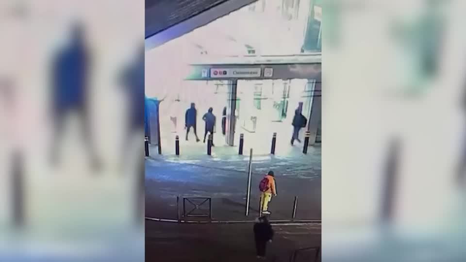 CCTV shows gunmen firing outside Brussels metro station | Reuters