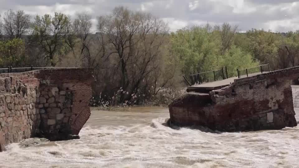 Historic bridge collapses after heavy rain hits central Spain | Reuters