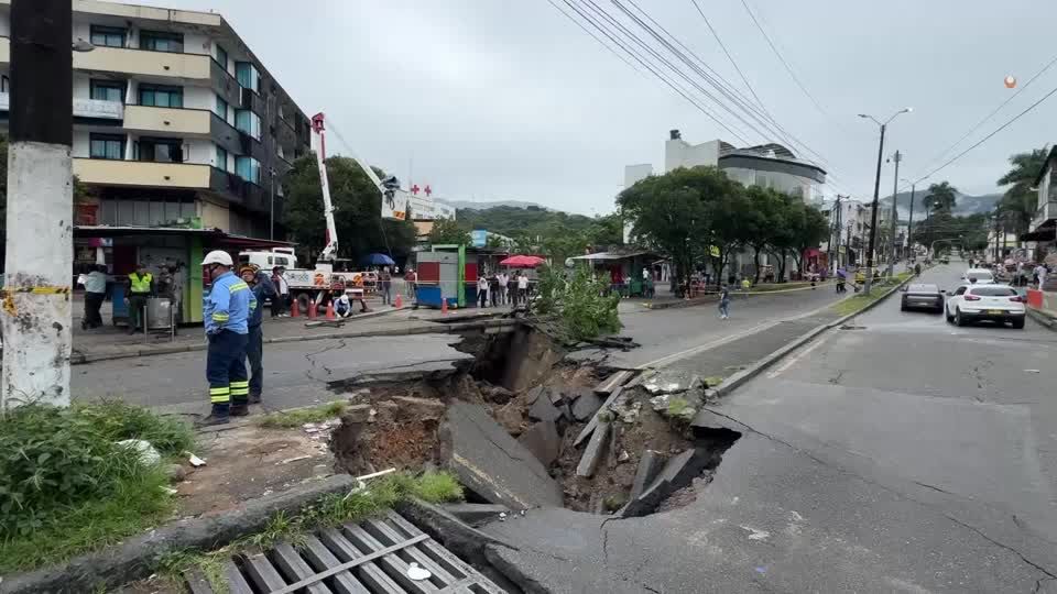 Heavy rain in central Colombia opens crater in street | Reuters