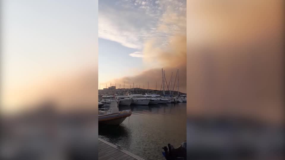 Smoke rises over the coast in southern France as wildfire rages on ...