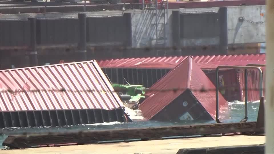 Dozens of containers tumble into water at California port | Reuters