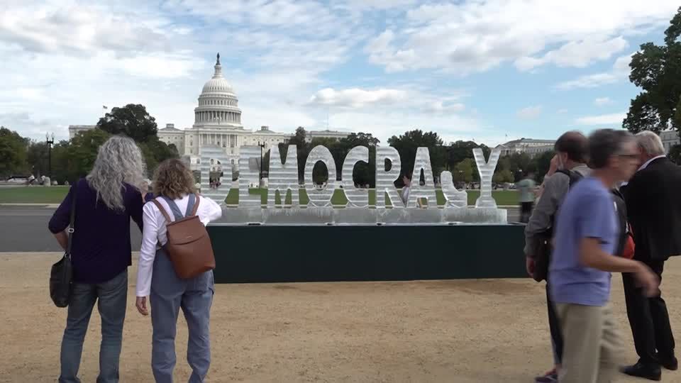 ‘Democracy’ ice sculpture melts on Washington’s National Mall | Reuters