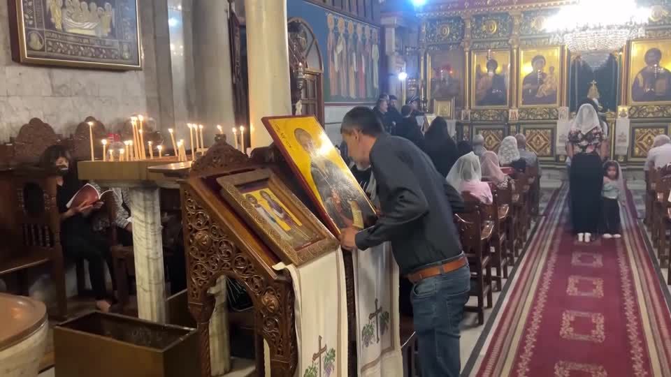 Truce allows father to grieve lost sons at Gaza City church | Reuters
