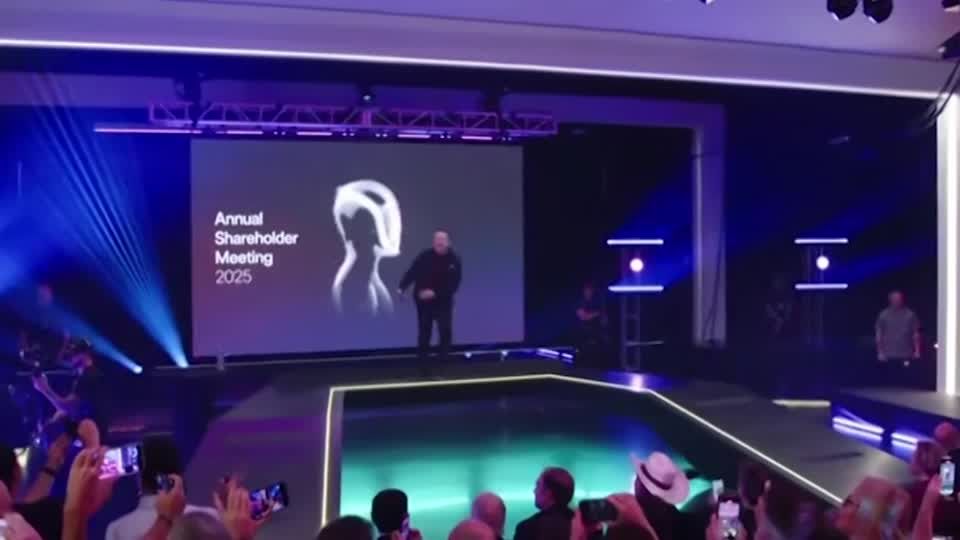 Musk shows off his dance moves at Tesla shareholders meeting | Reuters