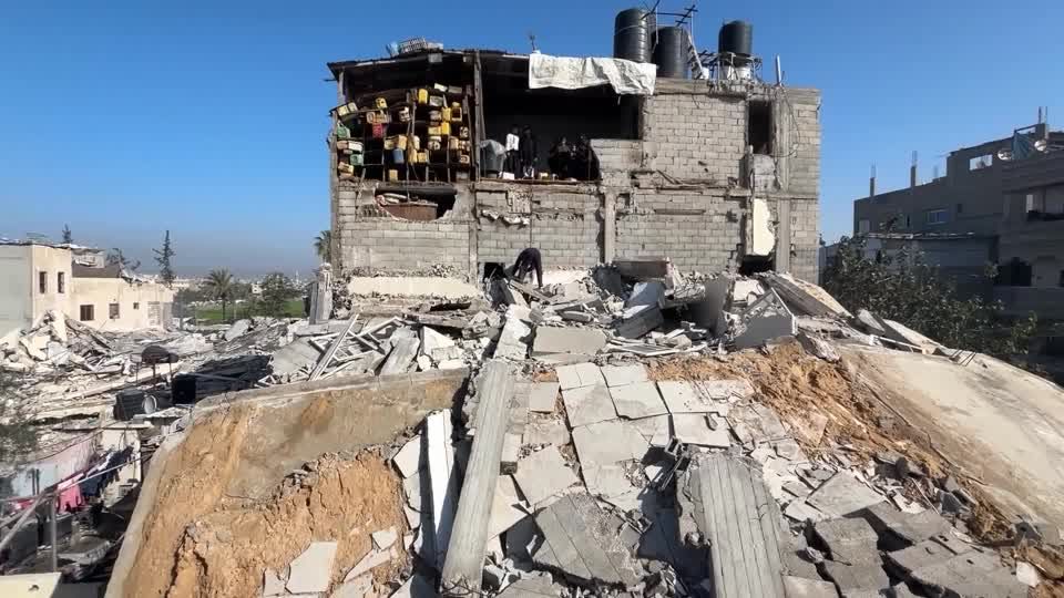 War-damaged building collapses in central Gaza, killing two | Reuters