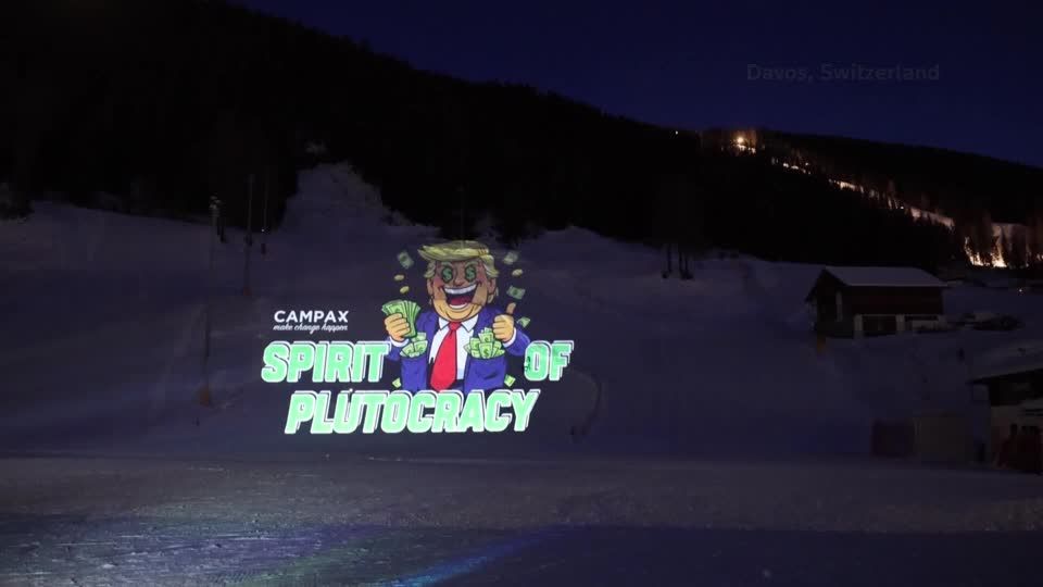 Activists use Trump ski slope projection to denounce Davos meeting ...