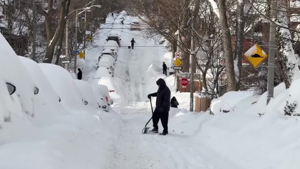 Toronto digs out from record-breaking snowfall | Reuters