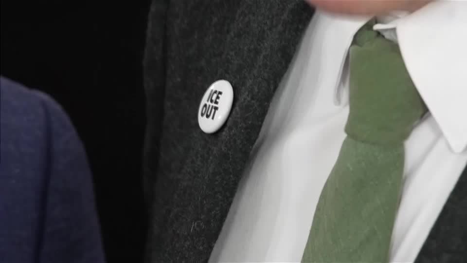 Guests and nominees wear 'ICE OUT' pins at this year's Grammys | Reuters