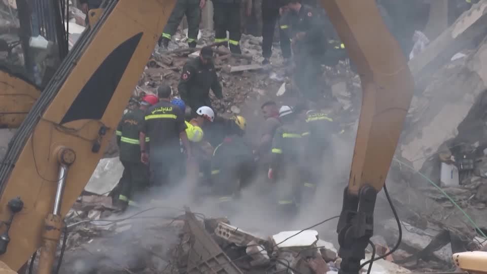 Rescue workers pull bodies from Lebanon building collapse | Reuters
