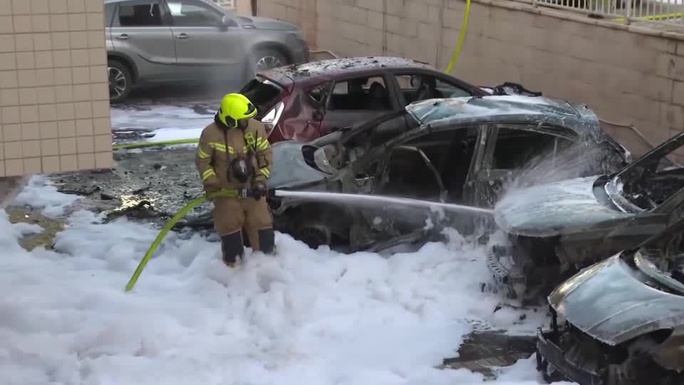 Vehicles damaged from missile debris in central Israel | Reuters