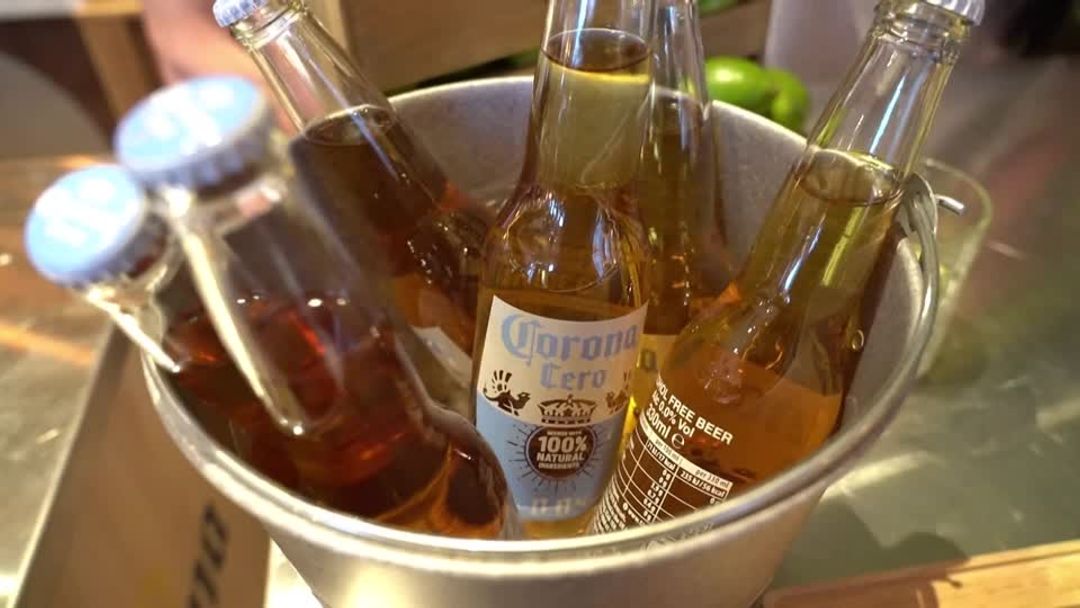 AB InBev returns to growth as it cheers better beer sales | Reuters